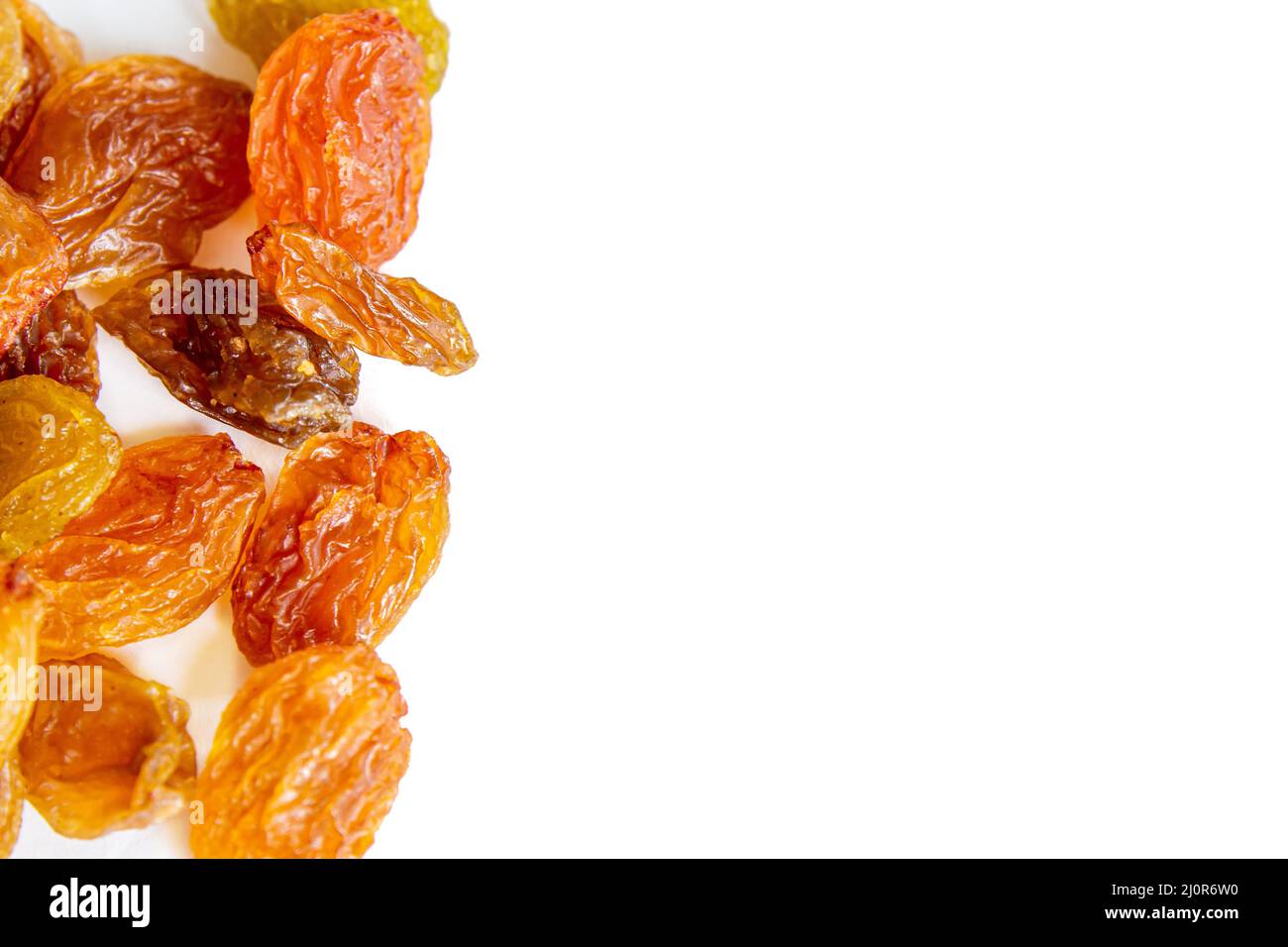 Top view yellow raisins isolated on white background Stock Photo - Alamy