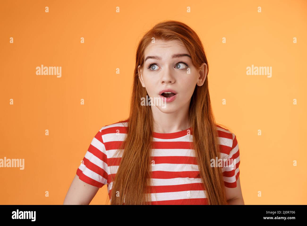 Close-up enthusiastic surprised, intrigued redhead caucasian woman look ...