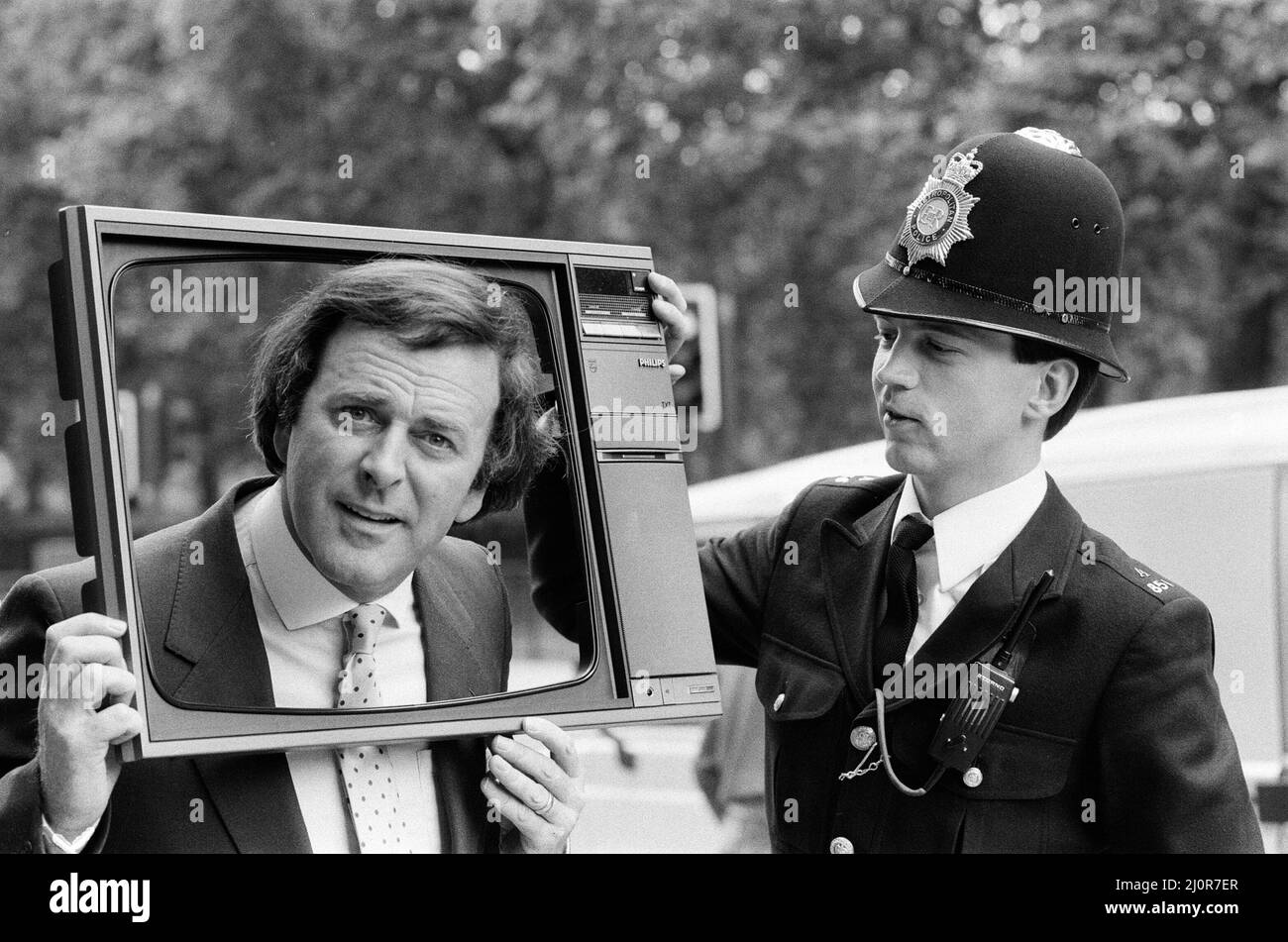 Terry Wogan was given 100 new TV sets today. They are being presented ...