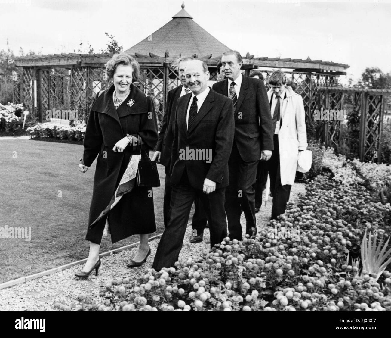 British Prime Minister Margaret Thatcher is led by Sir Leslie Young ...