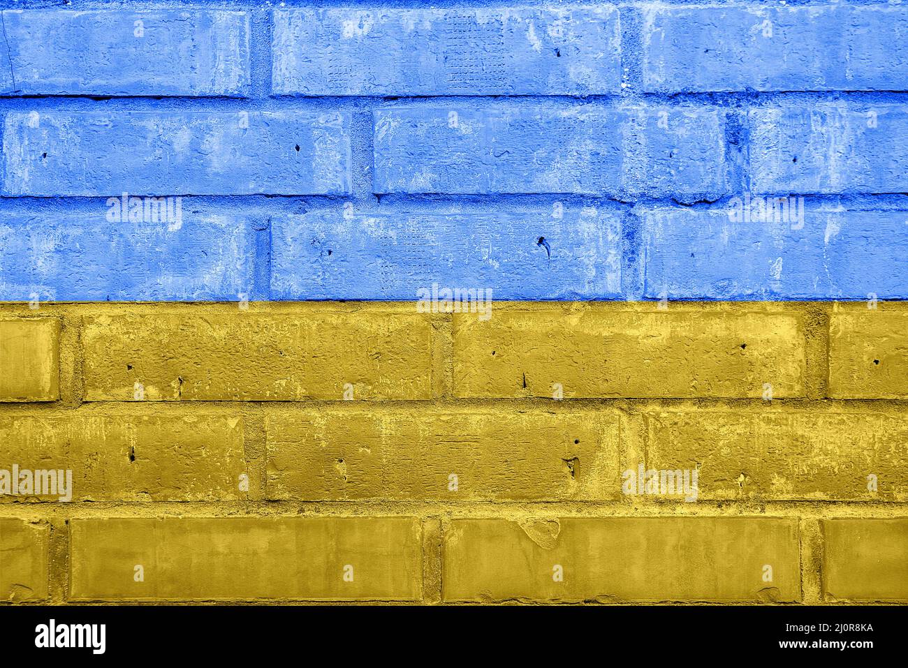 Ukraine flag painted on old brick wall texture background, white blue ...