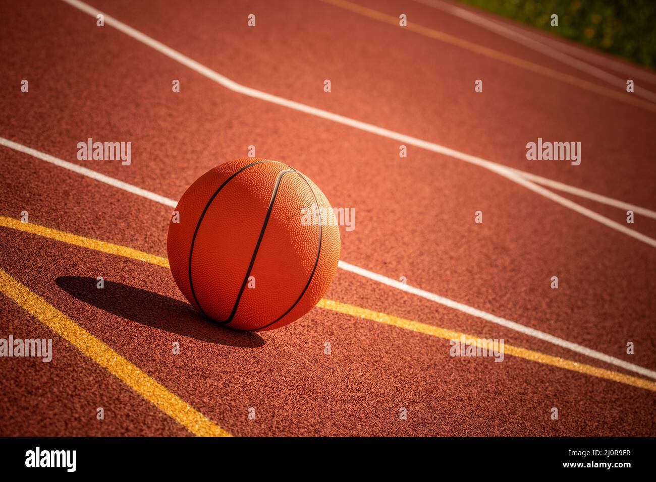 Ball left on the outdoor basketball court Stock Photo - Alamy