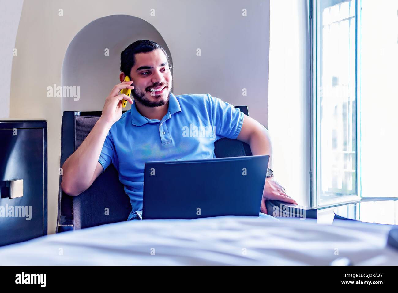 Smiling young guy in middle hi-res stock photography and images - Alamy