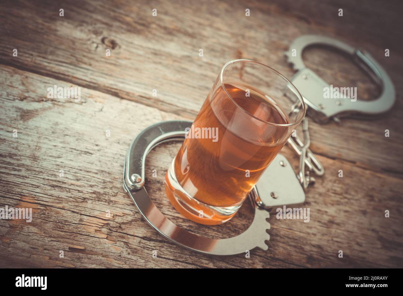 Handcuffs alcohol hi-res stock photography and images - Alamy