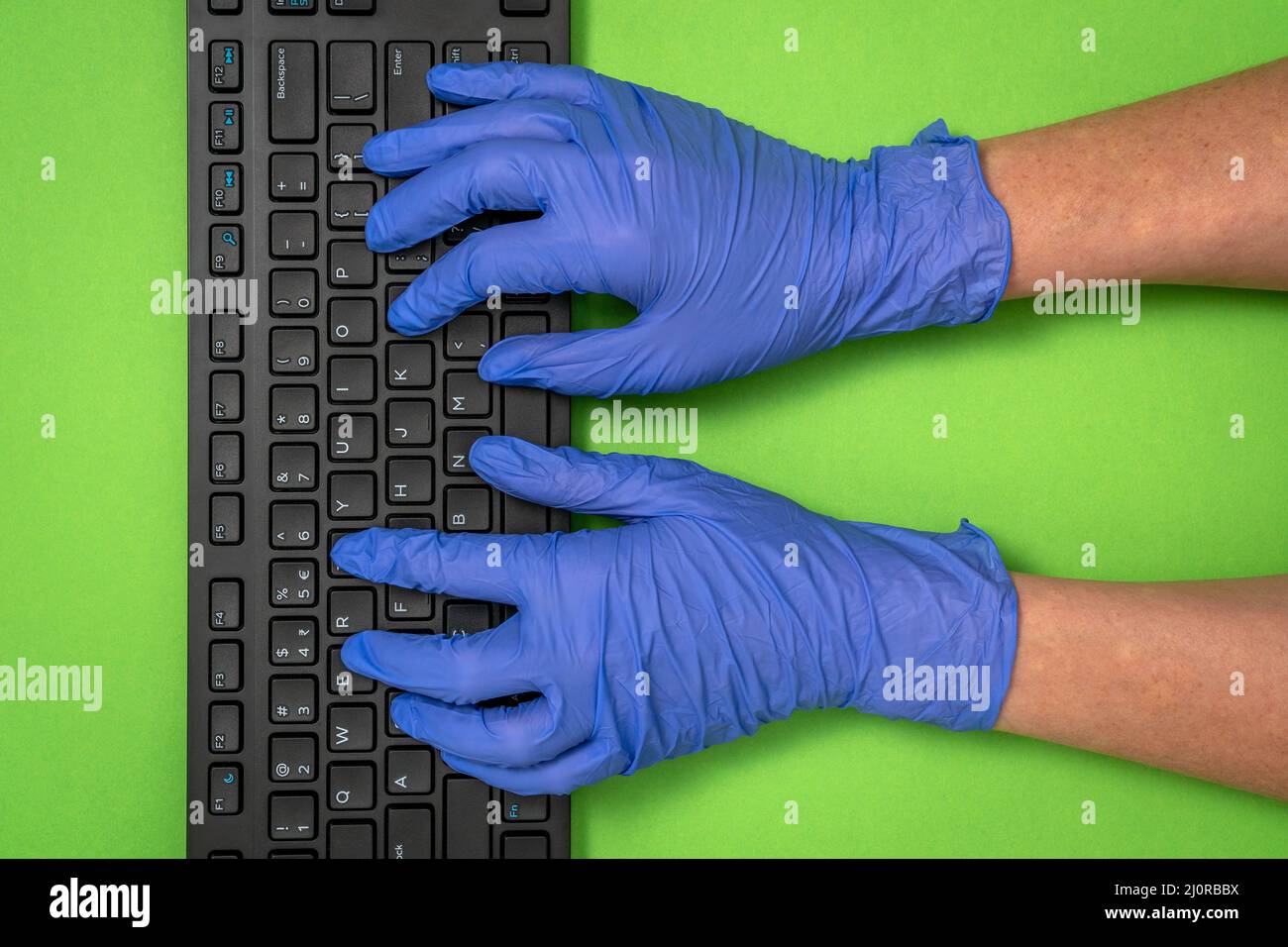 Computer keyboard hands gloves hi-res stock photography and images - Alamy