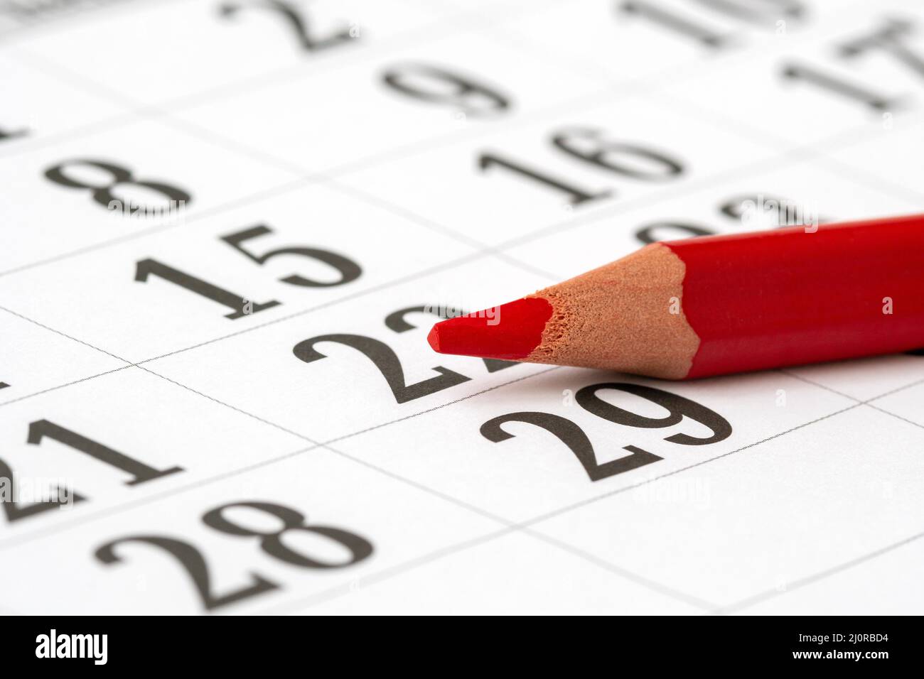 Calendar and a red pencil Stock Photo - Alamy