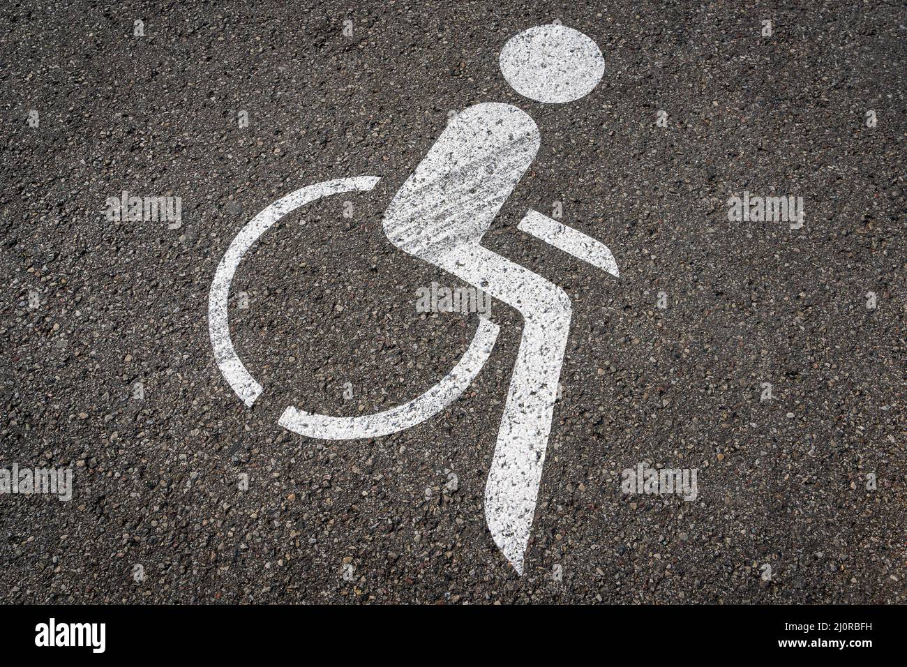 Parking sign on the asphalt ground for handicapped and disabled people ...