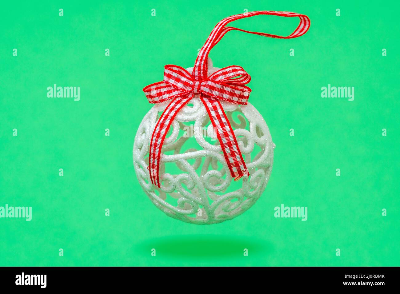 Decorative Christmas bauble with ribbon Stock Photo - Alamy