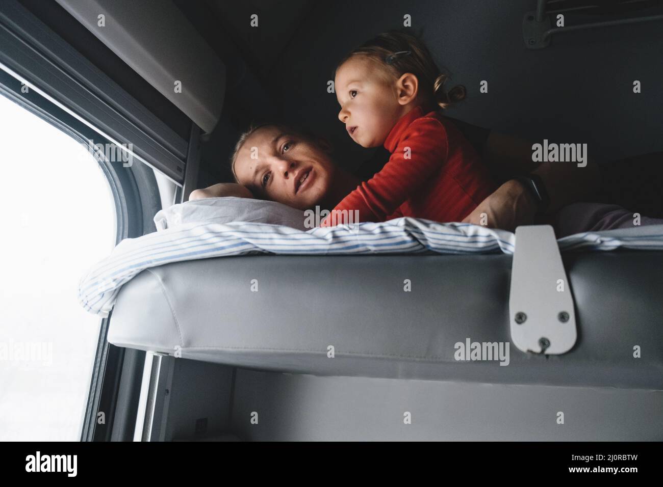 Father with child travalling in the train, having fun enjoying scene ...