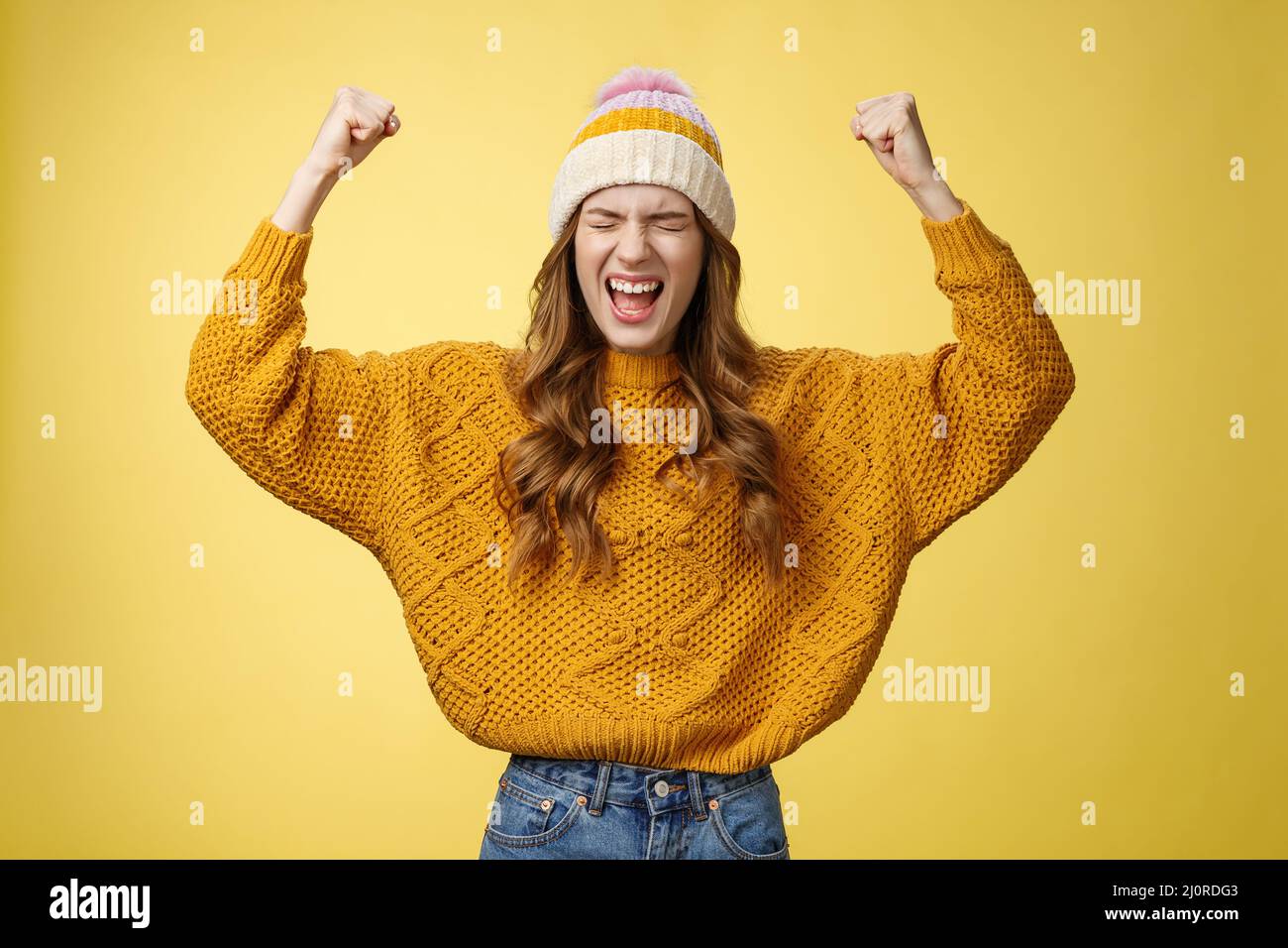 Relieved attractive fashionable university female student yelling ...