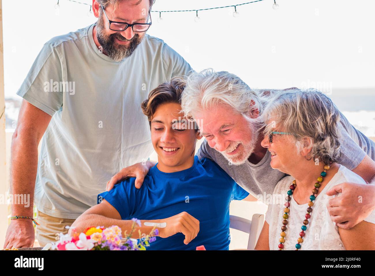 Happy mixed ages and generations caucasian family with young adult and ...