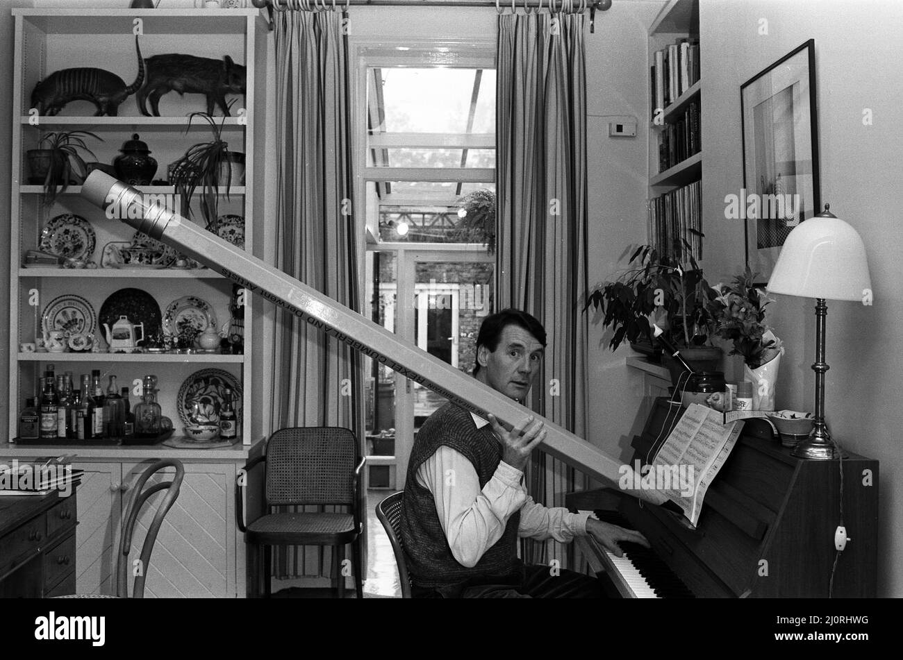 Actor and writer Michael Palin in his study at home. 7th November 1984 ...