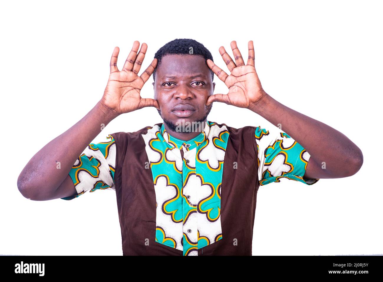 young man wearing loincloth shirt standing on white background making ...