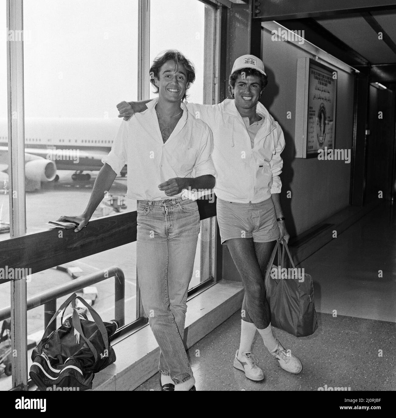 Andrew Ridgeley and George Michael of the pop group Wham!, arriving at ...