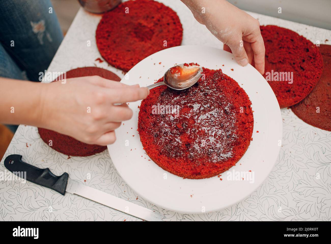 Pastry chef makes delicious red velvet cake. Cooking and decorating ...