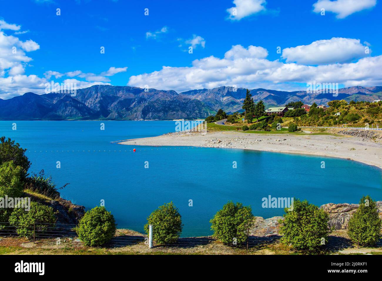 Azure lake among the colorful mountains Stock Photo - Alamy
