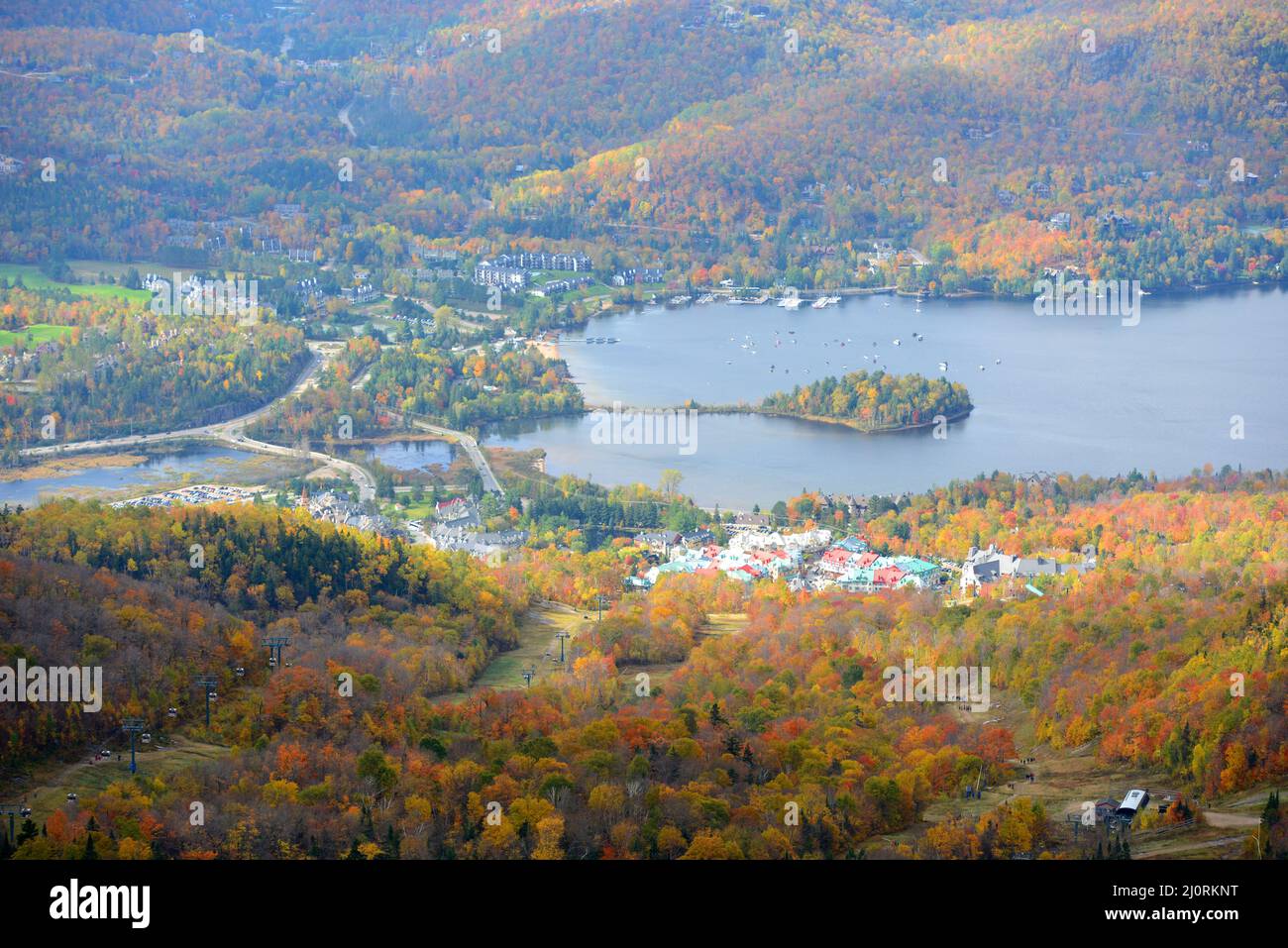 Aerial view of Lake Tremblant and Mont-Tremblant village in fall with ...