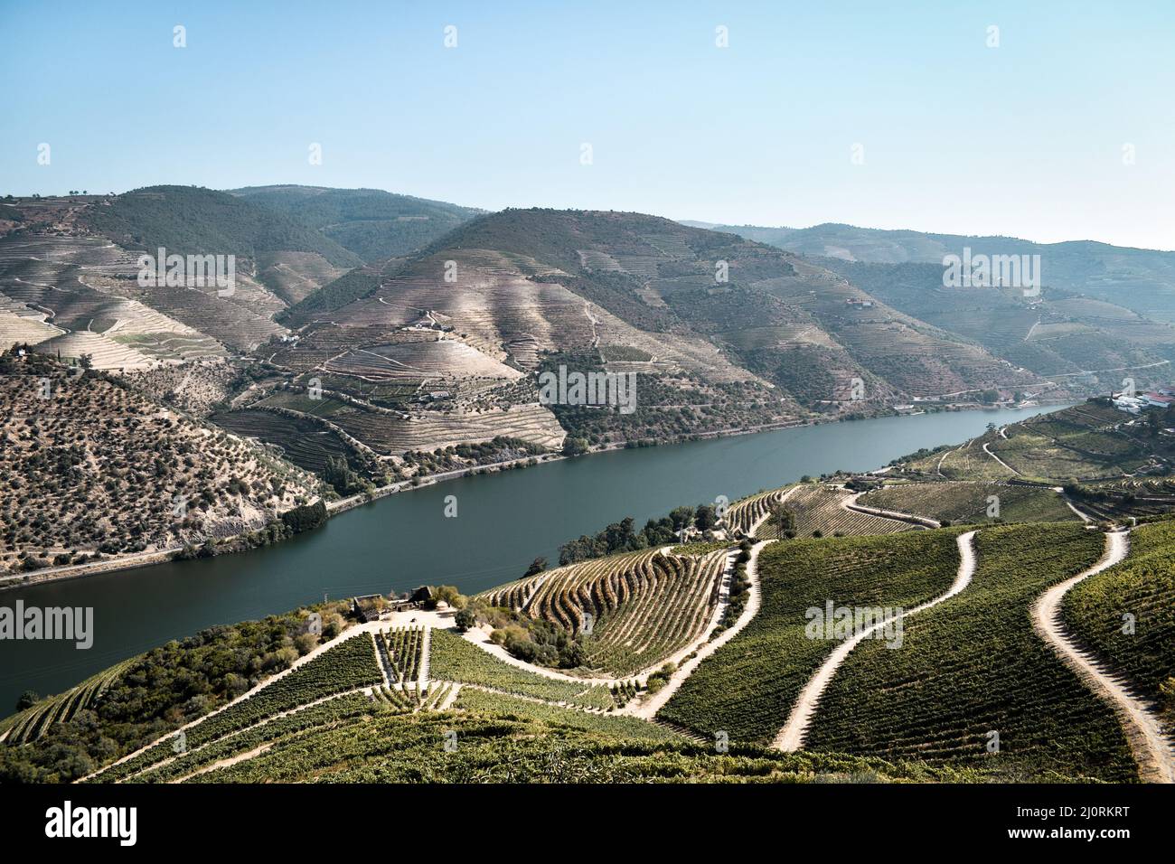Aerial view of the Douro river with vineyards and mountains around it ...