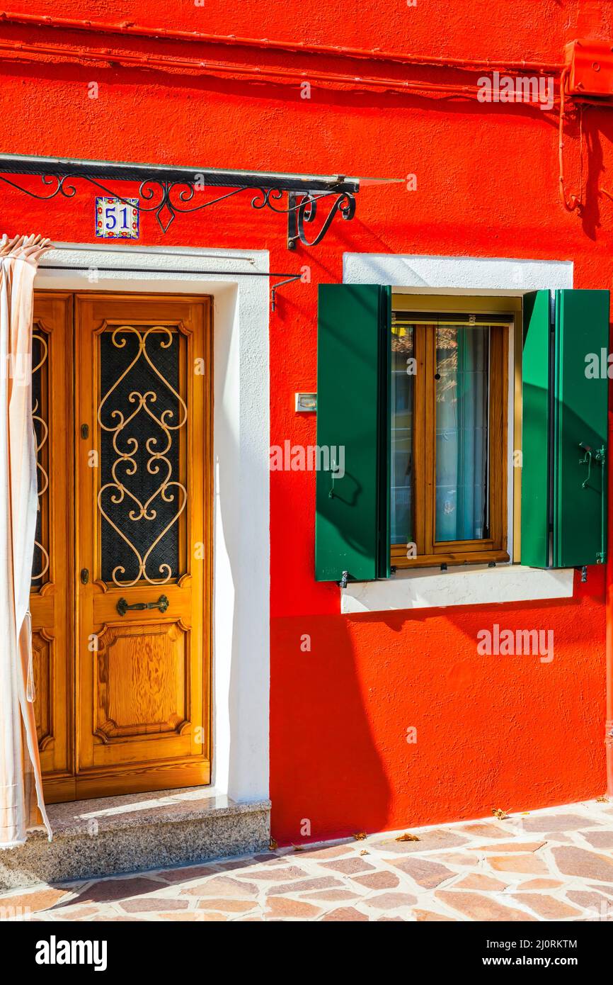 Facade of a lovely red house Stock Photo - Alamy