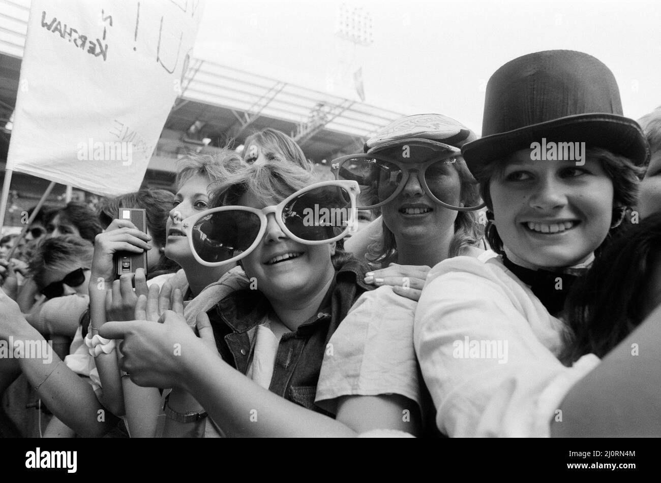 Fans at the "Summer of 84" concert at Wembley Stadium, which featured ...