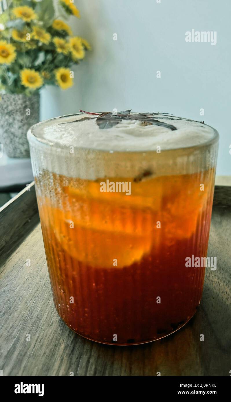 A vertical closeup of a cold lemon tea in a glass cup Stock Photo - Alamy