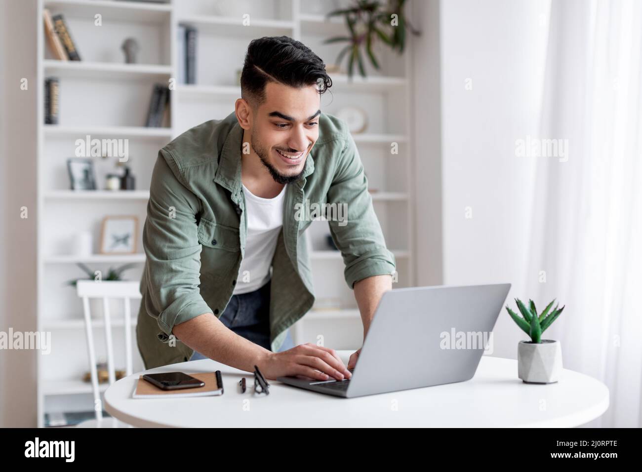 Man standing at office desk hi-res stock photography and images - Alamy