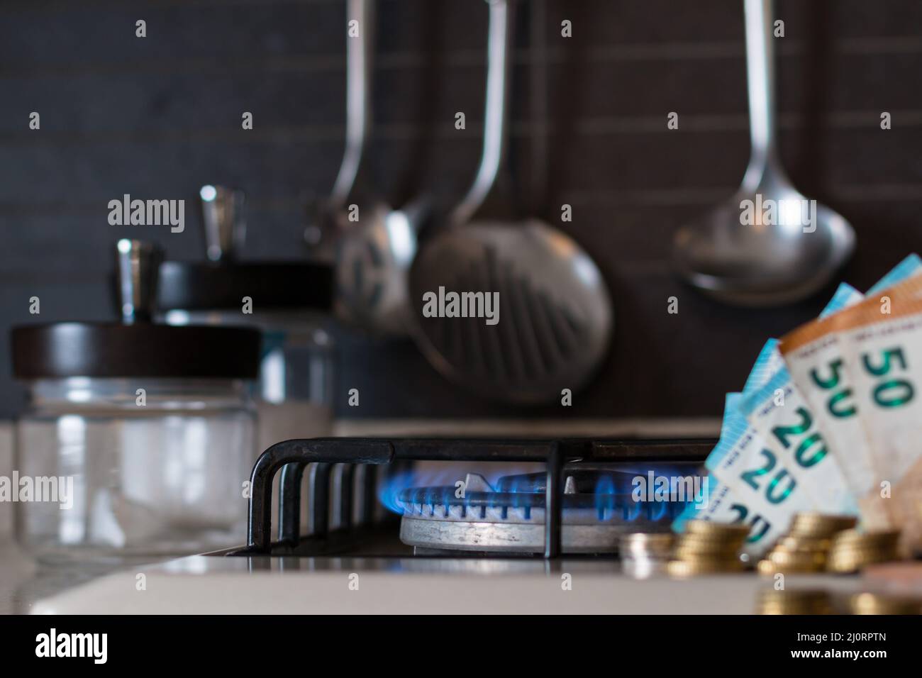 Photo of stove behind of money Stock Photo - Alamy