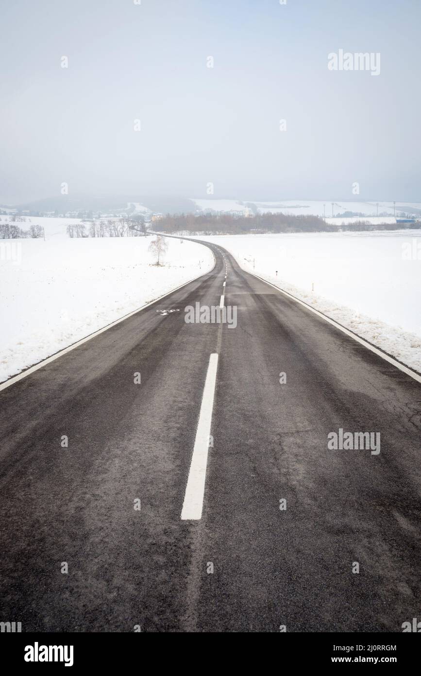 Beautiful snowy country road hi-res stock photography and images - Alamy