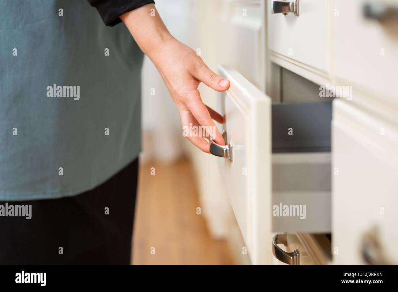 Hand closing drawer hi-res stock photography and images - Alamy