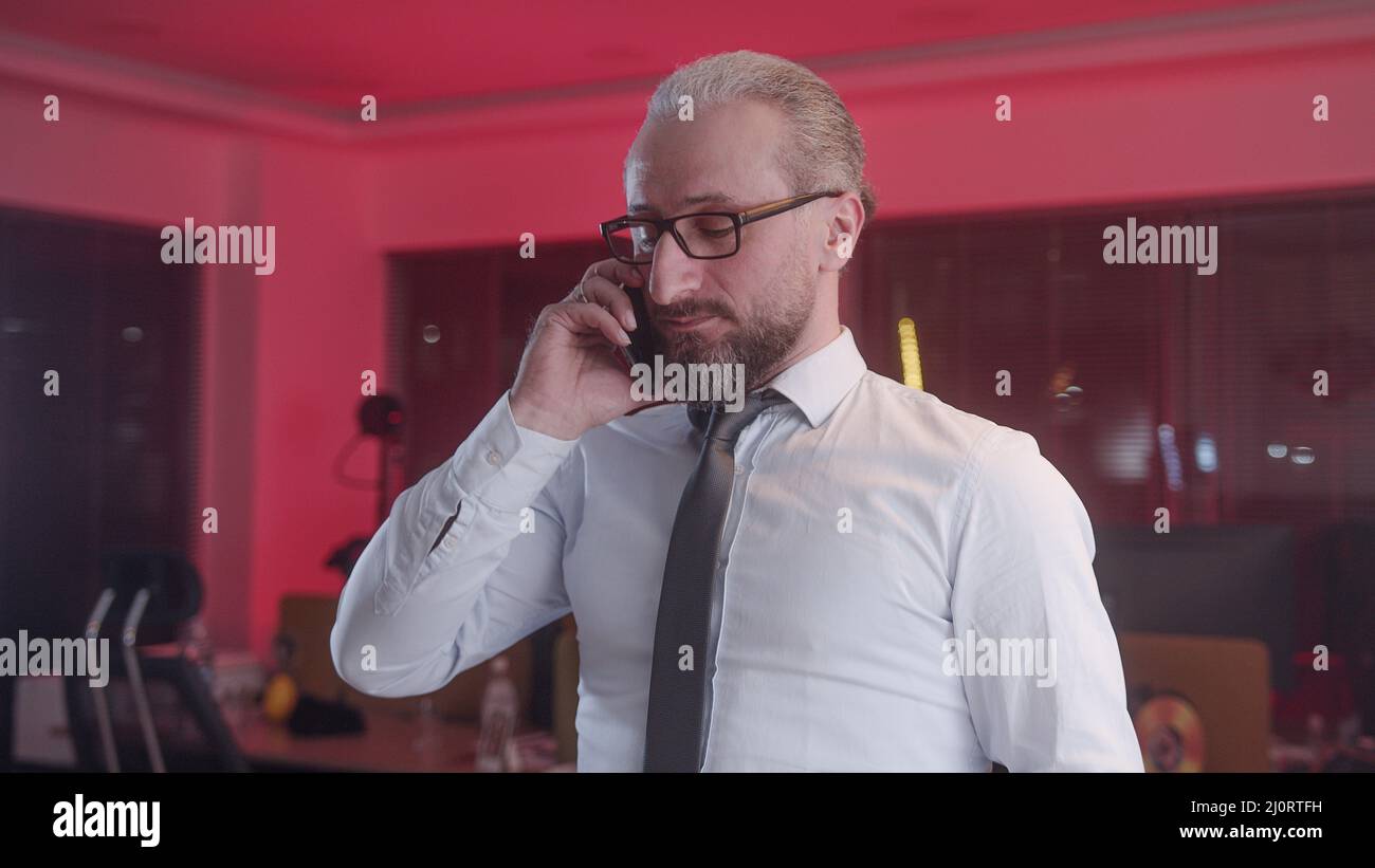 Bearded happy middle-aged top office manager in suit standing and ...