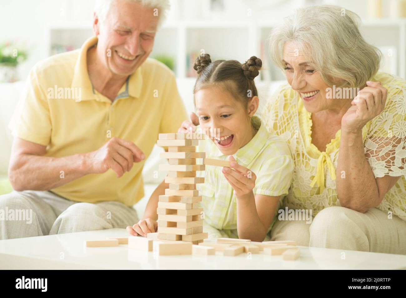 Portrait of happy family playing with wooden blocks Stock Photo - Alamy