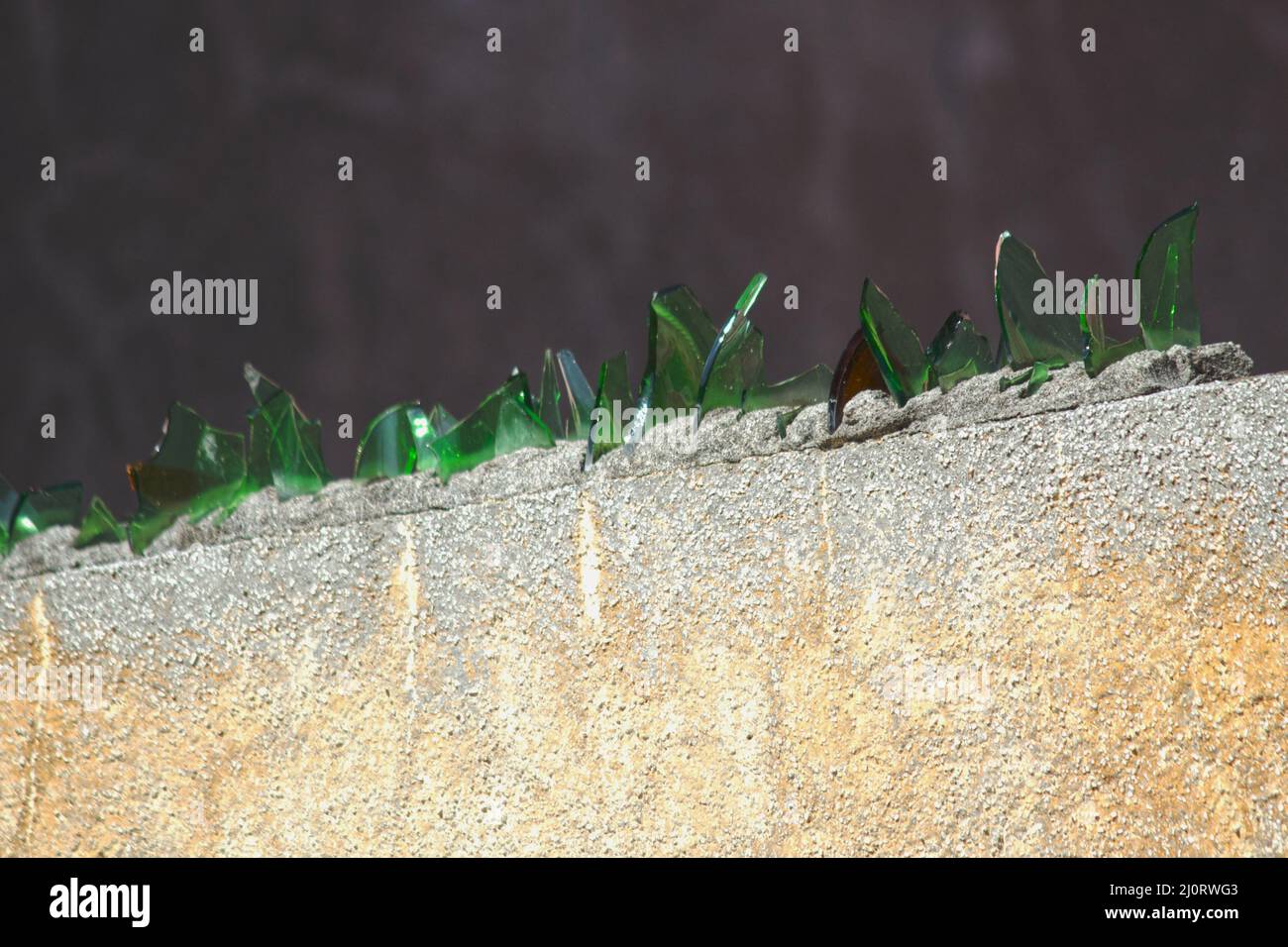 Broken glass pieces on the wall Stock Photo - Alamy