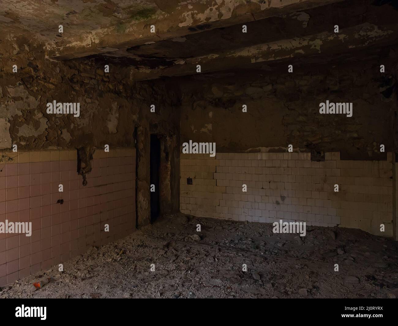 An empty ruined room of old abandoned building. Utility room of an old ...