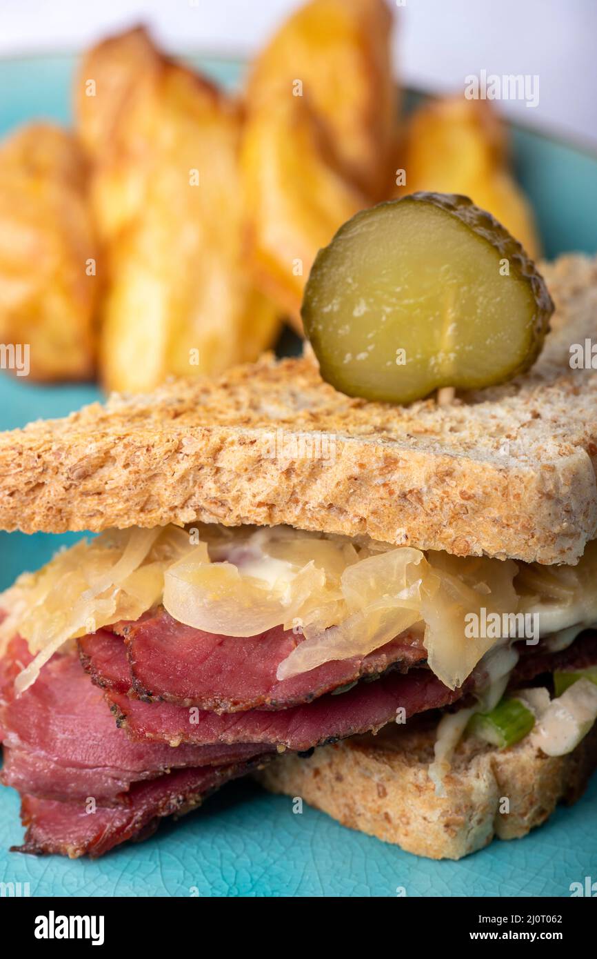 reuben sandwich on a plate with fries Stock Photo - Alamy