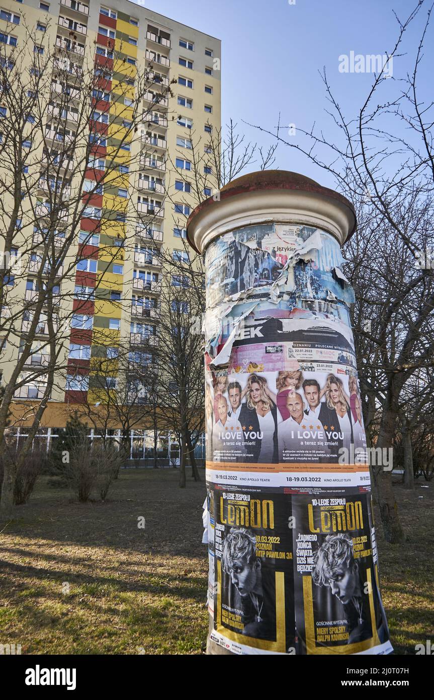 An advertisement cylinder including a Lemon concert poster close by a ...