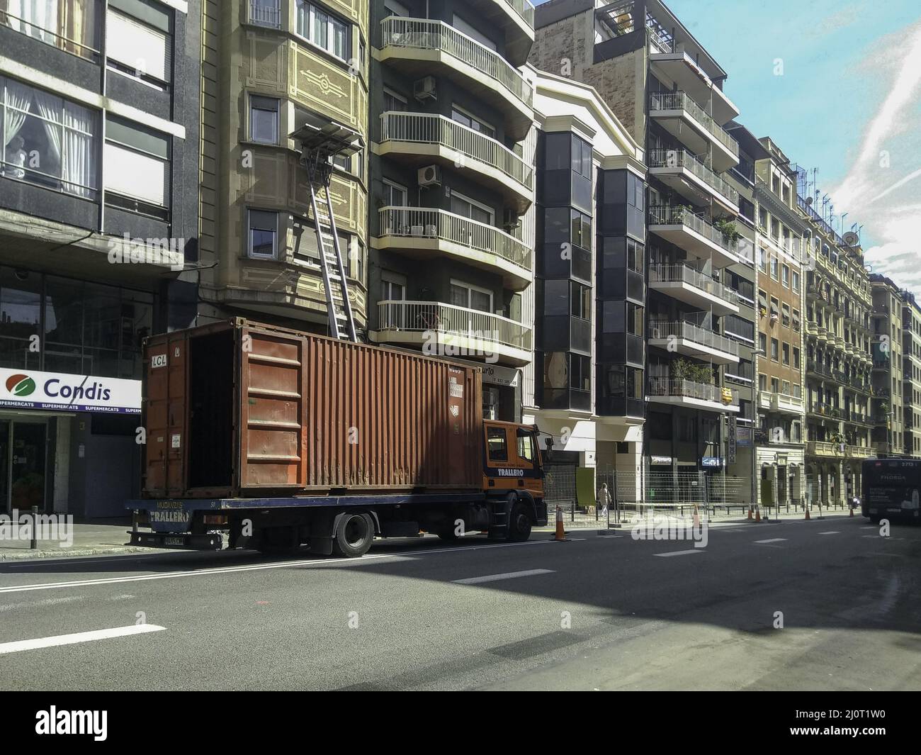 Big Iveco truck with bug container trailer doing removals with the ...