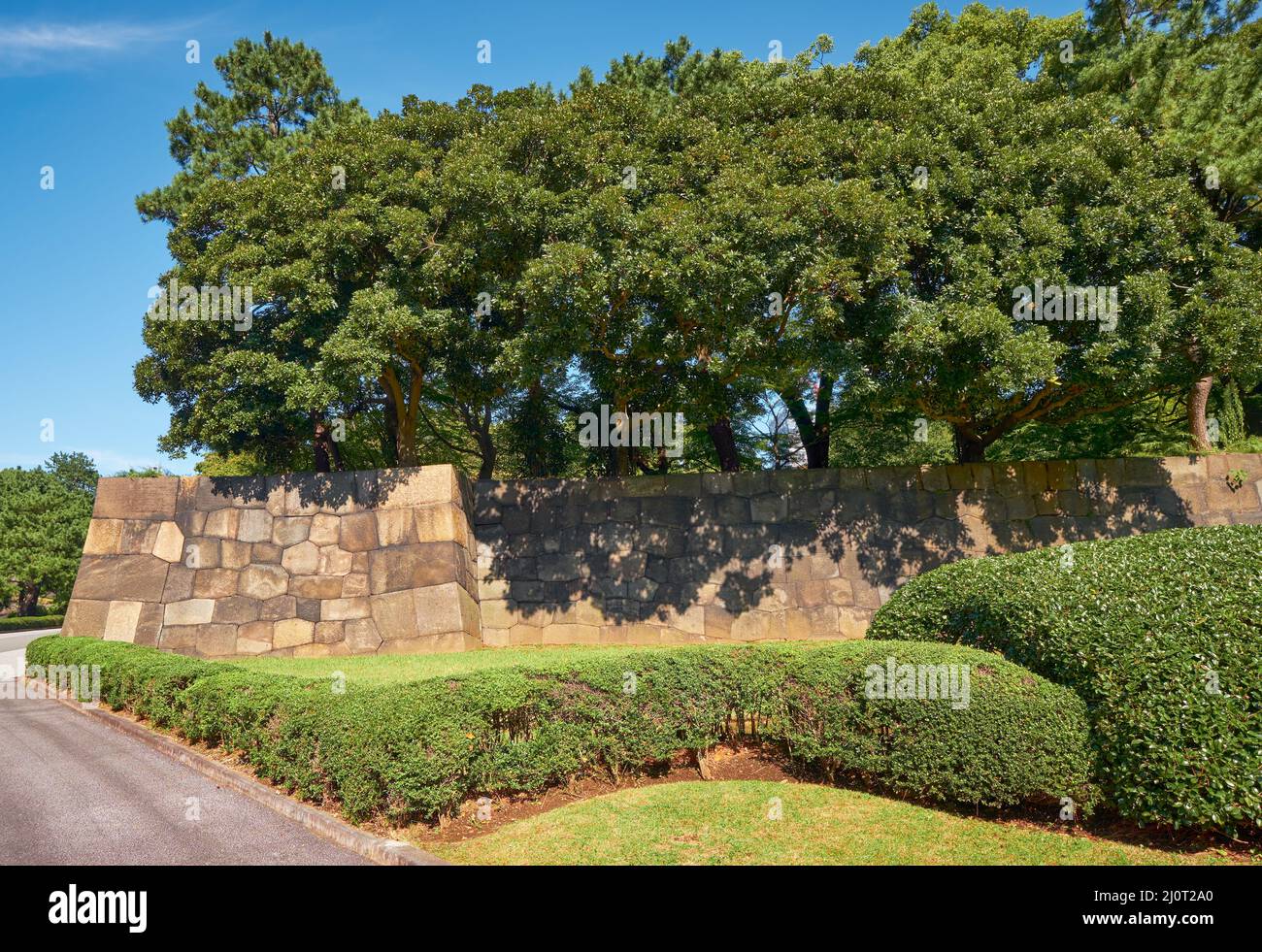The stone wall of the old Edo castle in the Tokyo Imperial Palace ...
