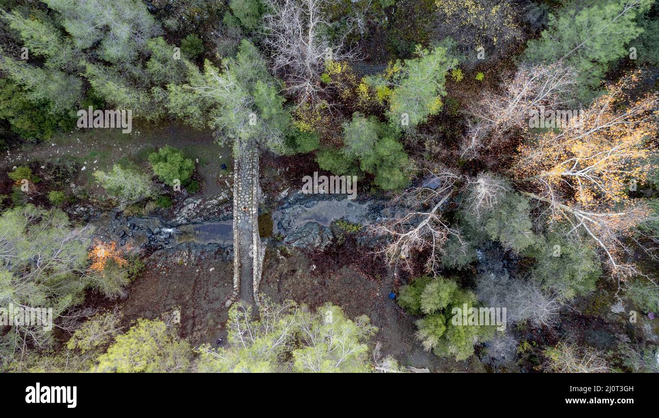 Aerial drone photograph of a medieval stoned bridge in autumn. Elia ...