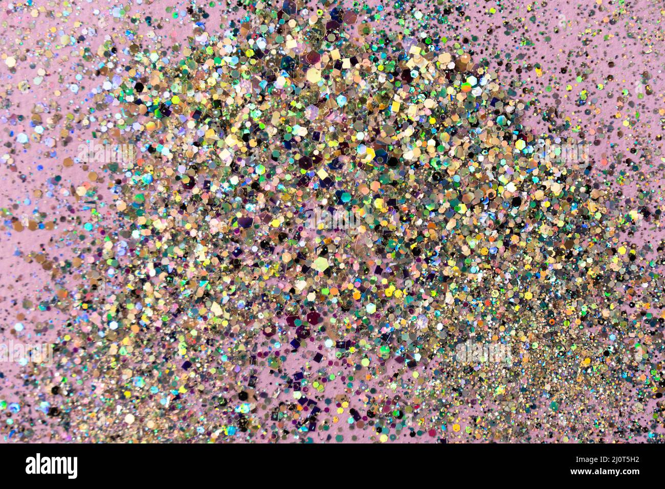 Gold sequins on pastel pink background. Festive concept. High quality ...