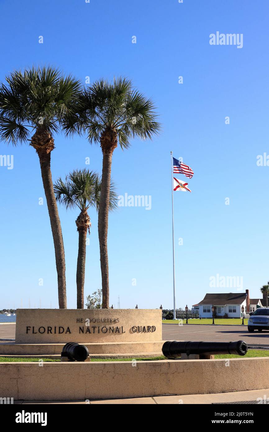 The sign of Headquarters of Florida National Guard with palm trees and ...