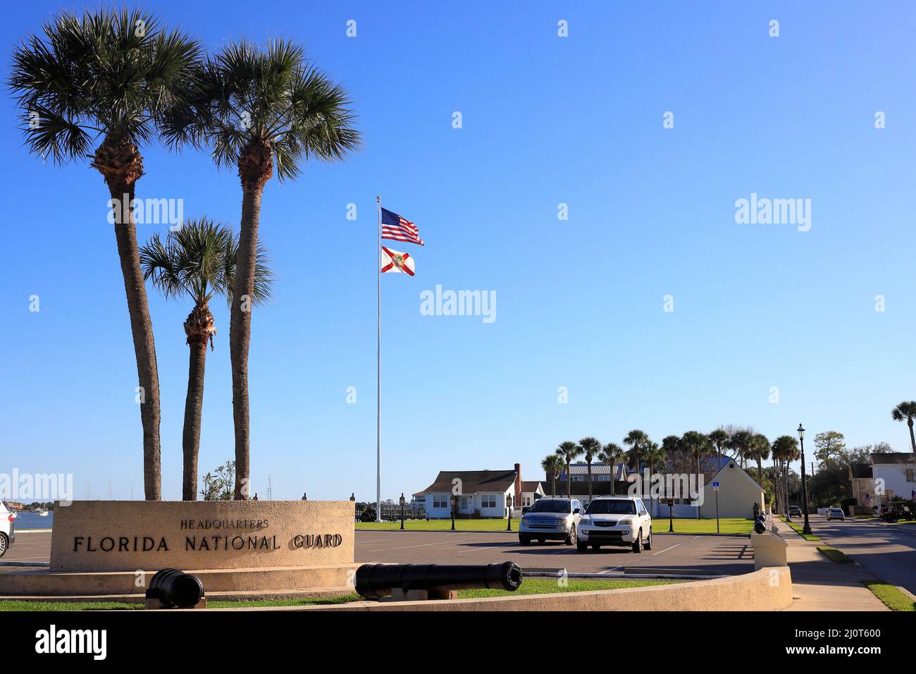 The sign of Headquarters of Florida National Guard with palm trees and ...