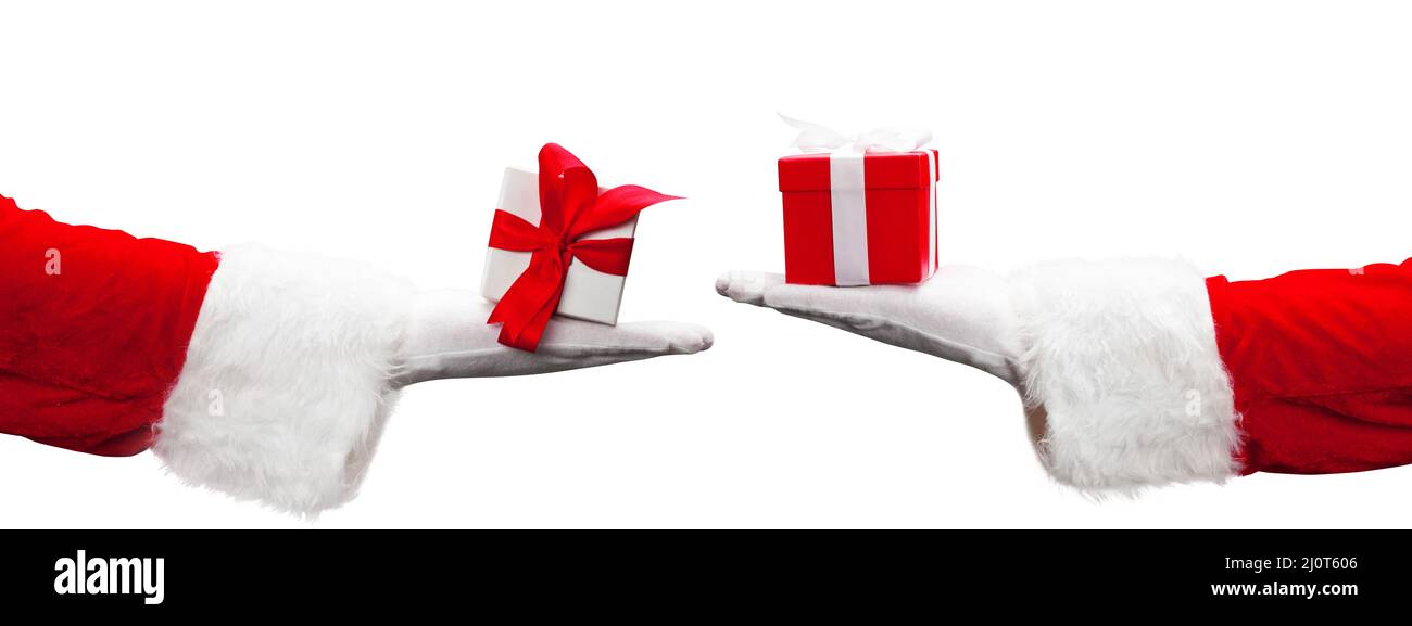 Santa Claus hand holding a wrapped Christmas present Stock Photo - Alamy