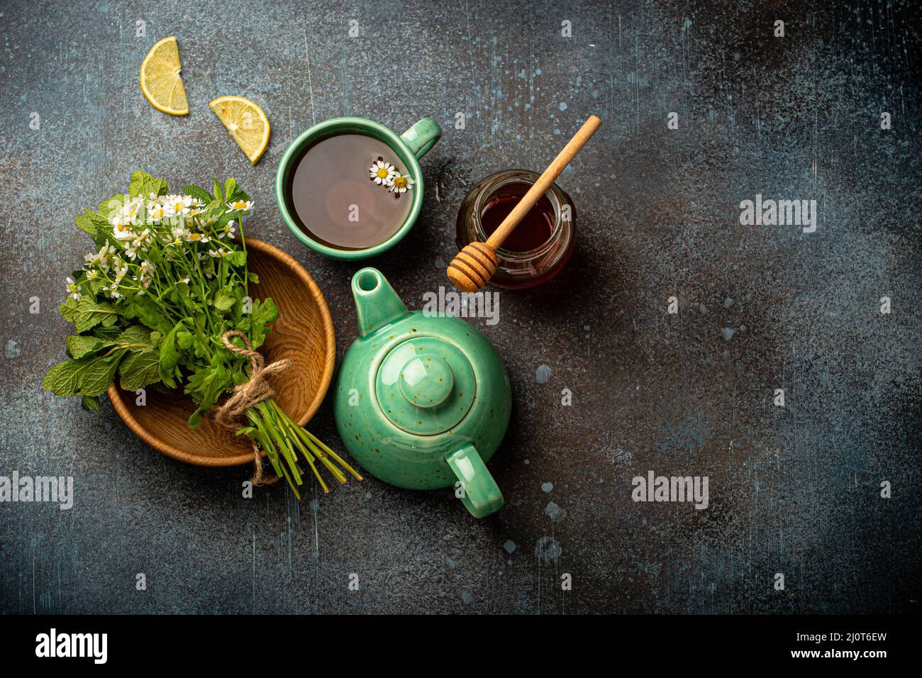 Herbal tea with natural healing medical herbs, tea cup, tea pot top ...