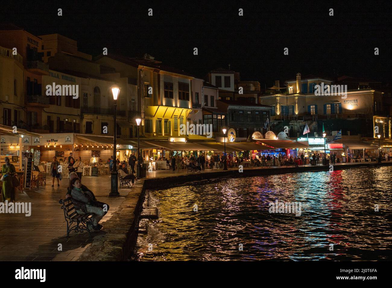 Chania (Crete, Greece) seaside with restaurants at night Stock Photo ...