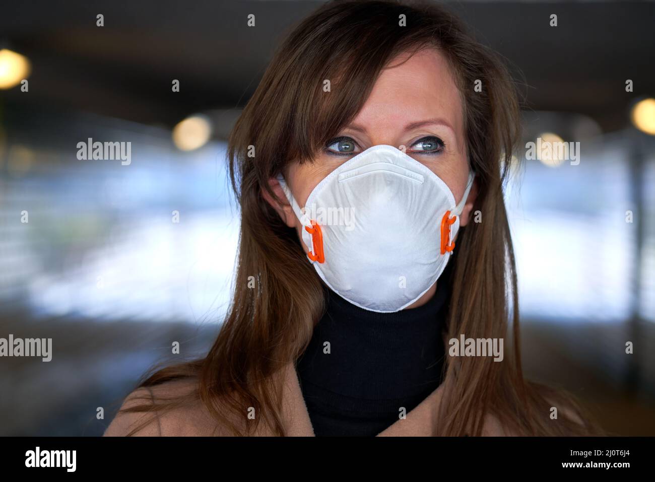 Coronavirus disease - woman wearing face mask in a public to protect ...