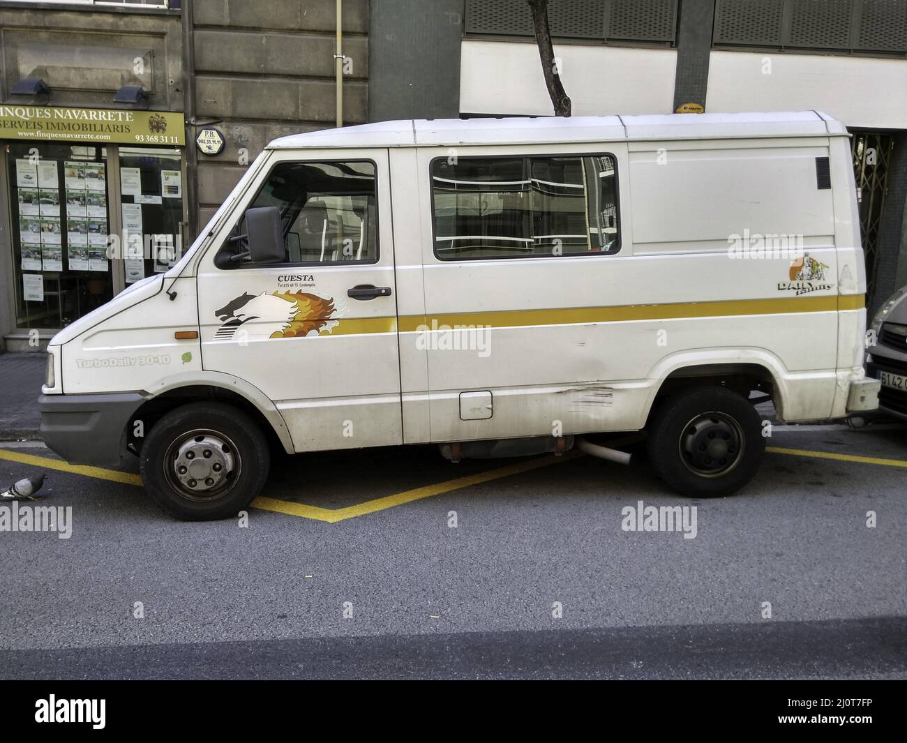 Old and white van Iveco Daily model 30-10 parked in the street ...