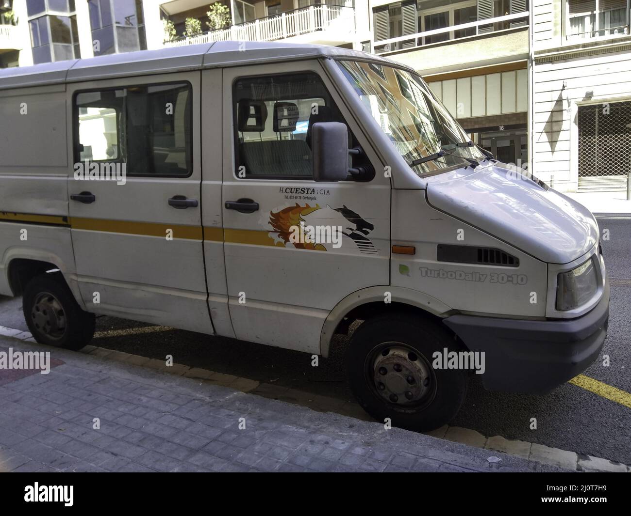The old and white van Iveco Daily model 30-10 parked in the street ...