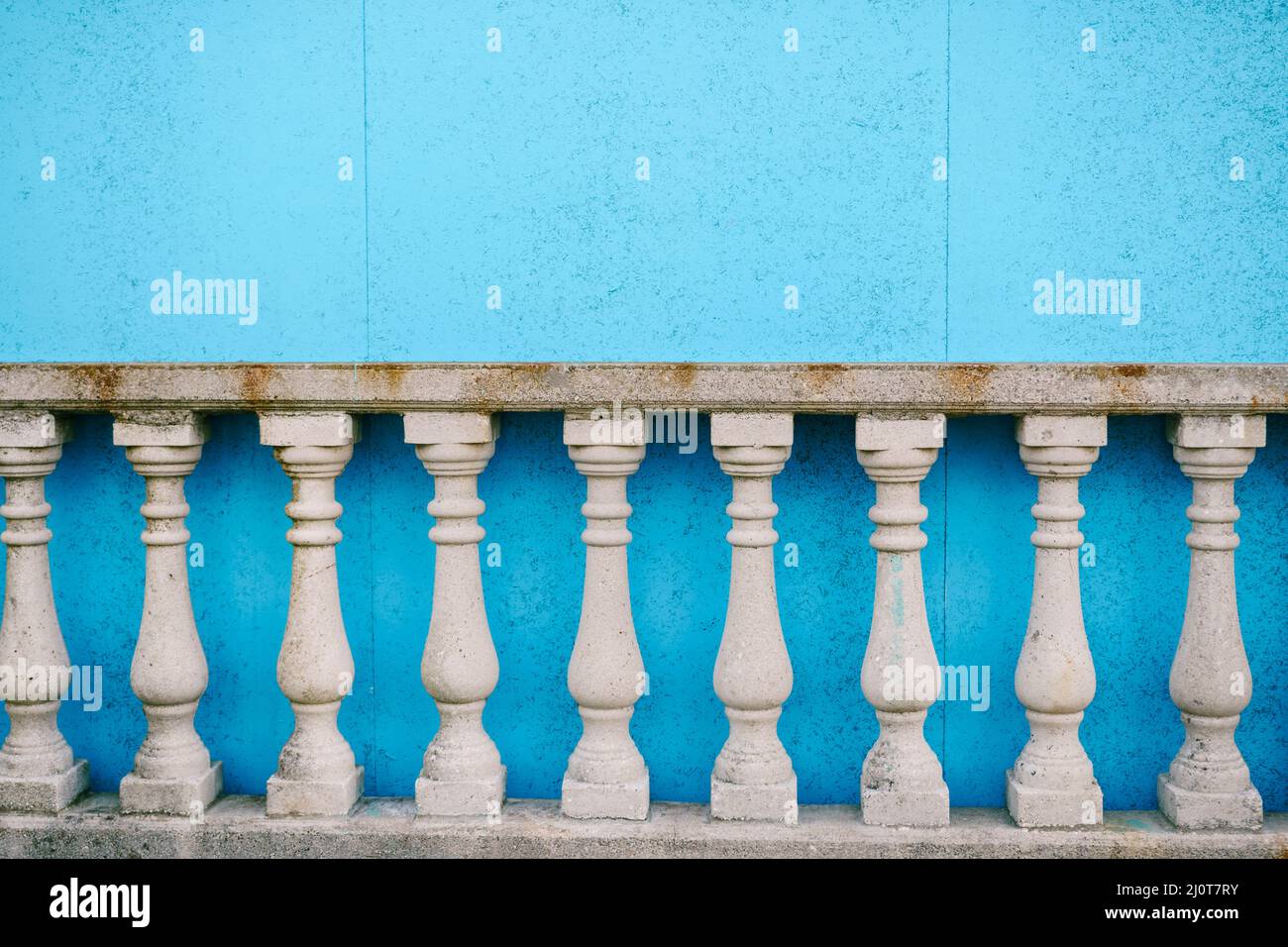 White stone balustrade in classical style near the blue wall Stock ...