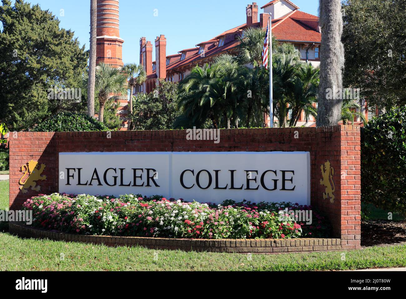 The sign of Flagler College with the college campus in the background ...