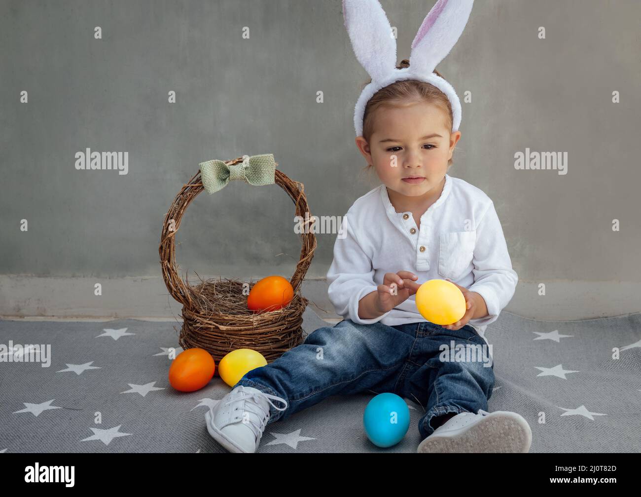 Cute Little Boy Dressed as a Bunny Playing with Decorations. Kid with ...